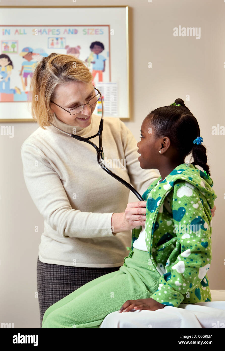 A pediatric doctor examines a child patient Stock Photo - Alamy