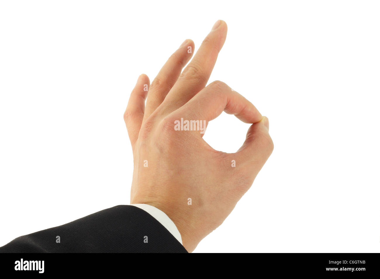 Business man's hand signing okay Stock Photo - Alamy