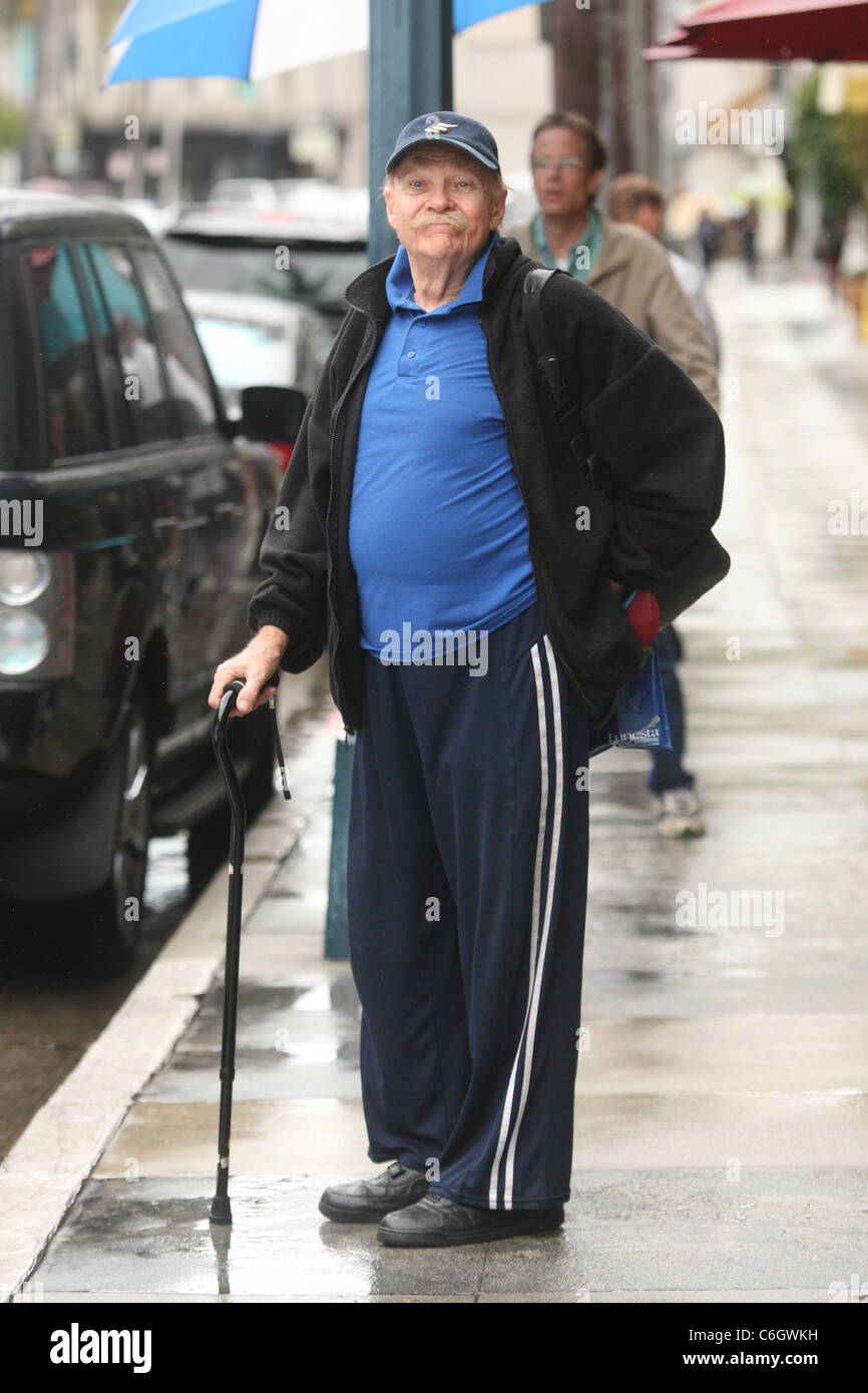 Rip Taylor American comedian and actor leaving a medical centre using a ...