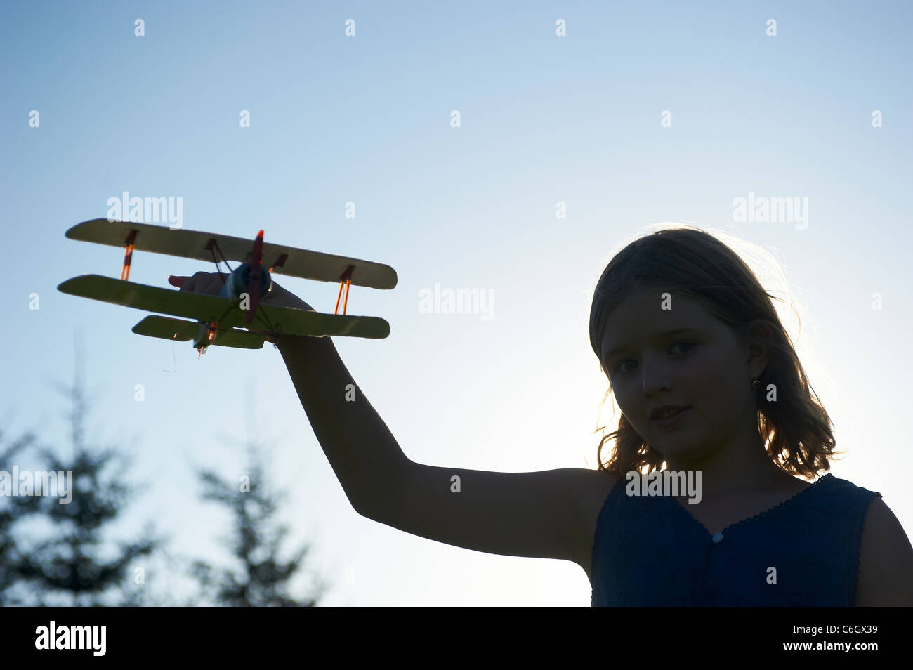 Child Girl flying model airplane Stock Photo - Alamy
