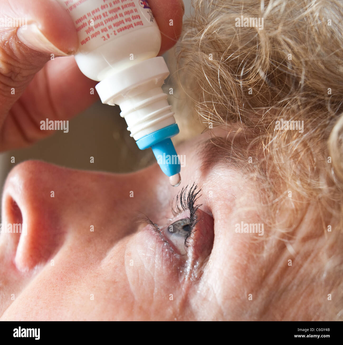 Putting eye drops into eyes hi-res stock photography and images - Alamy