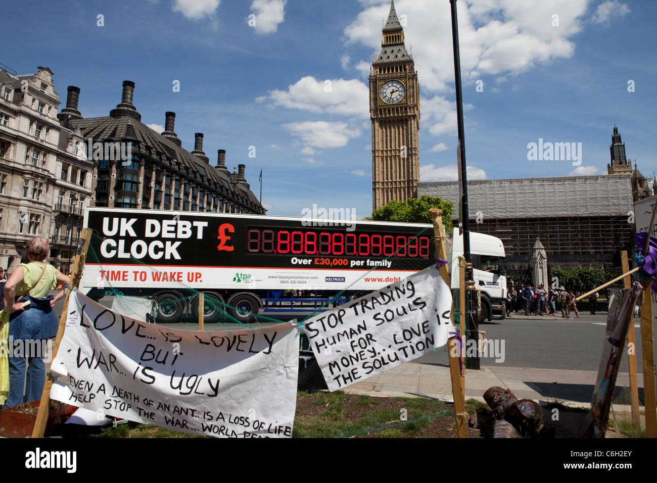A van with "UK Debt Clock" written on the side drives around Parliament ...
