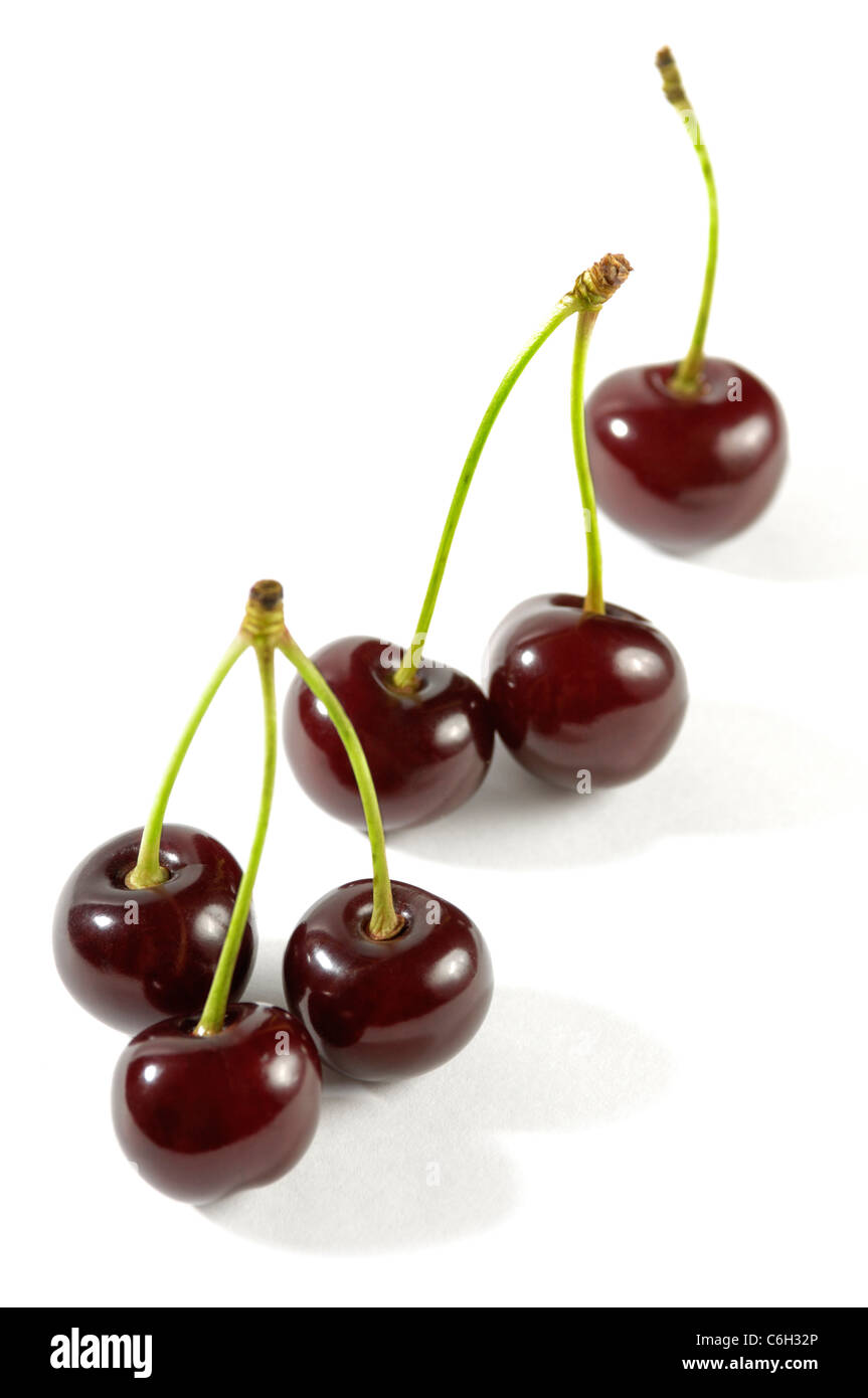 One Two and Three cherries close-up Isolated over white background ...