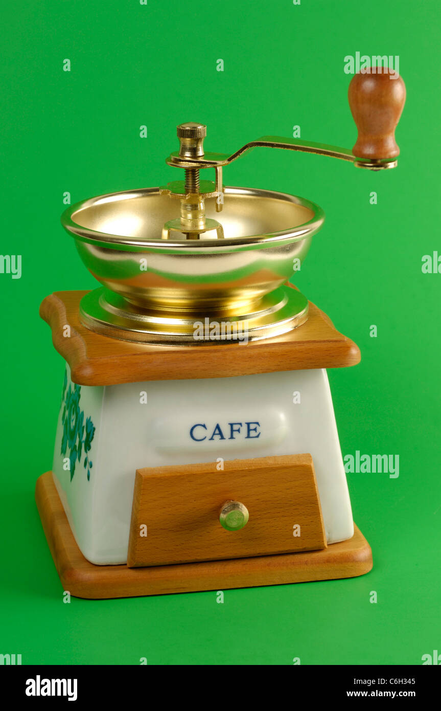 Coffee grinder close-up Isolated on green background Stock Photo - Alamy