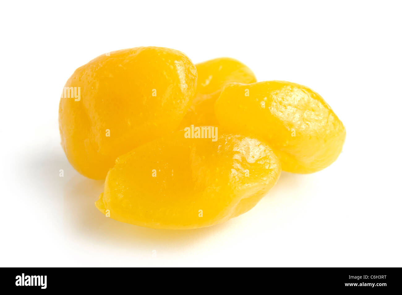 Dried lemons in sugar syrup close-up Isolated over white background ...
