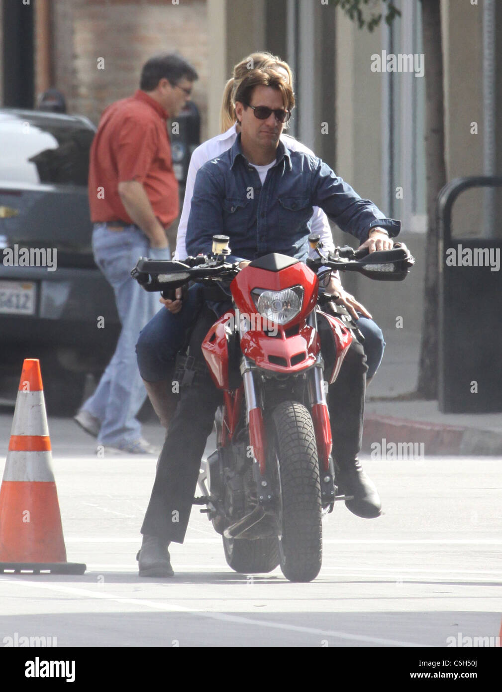 Stunt doubles for Tom Cruise and Cameron Diaz riding a motorcycle while ...