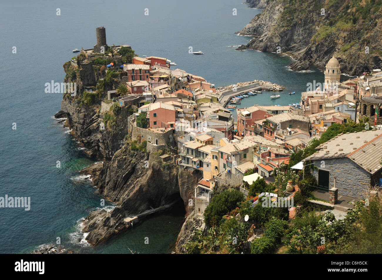 The headland and harbor of Vernazza, one of the stunningly beautiful ...
