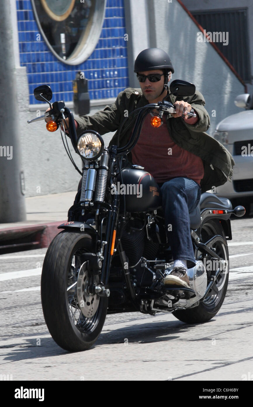 Adrian Grenier riding a Harley-Davidson motorcycle during a scene. Cast ...