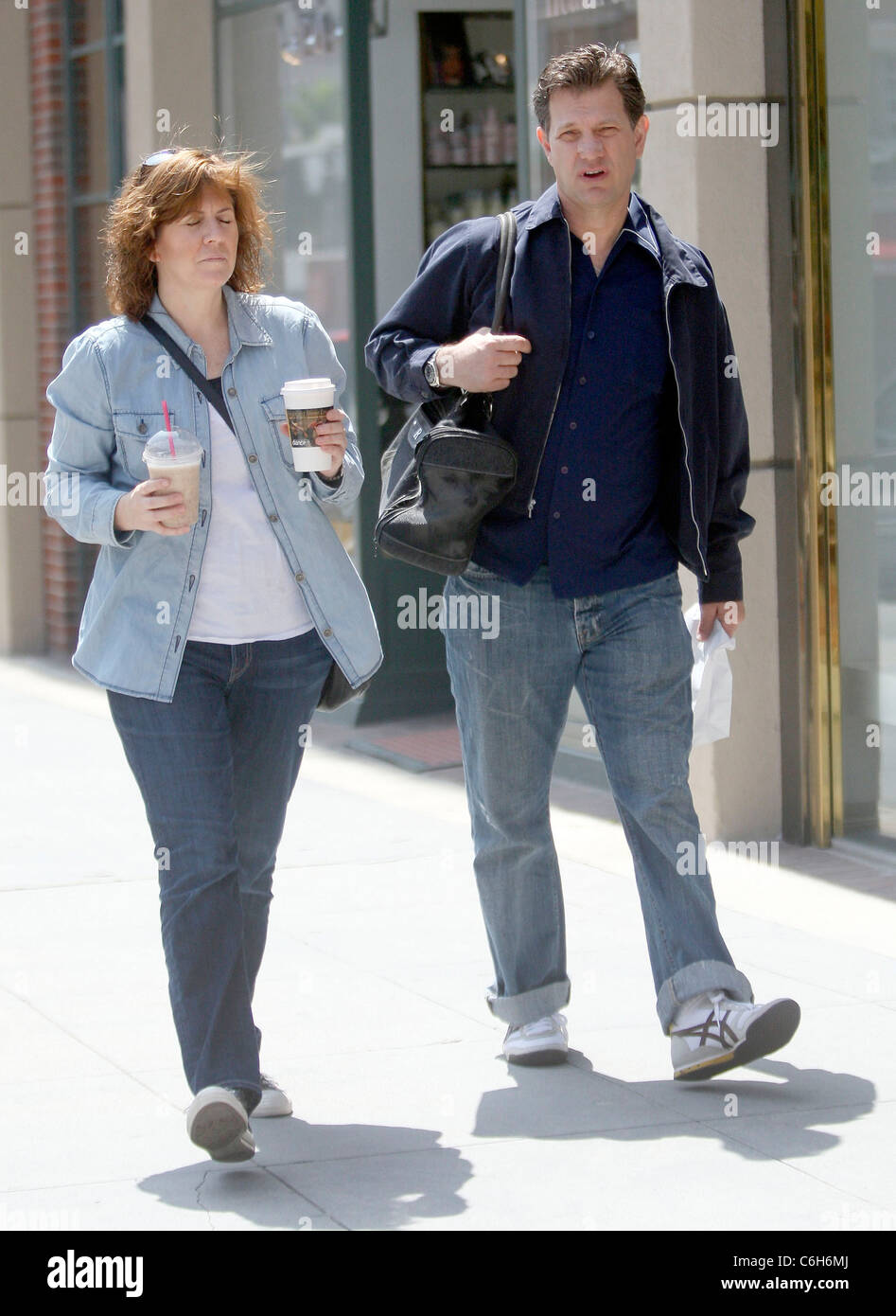 Singer Chris Isaak leaving a medical building with a friend Beverly ...