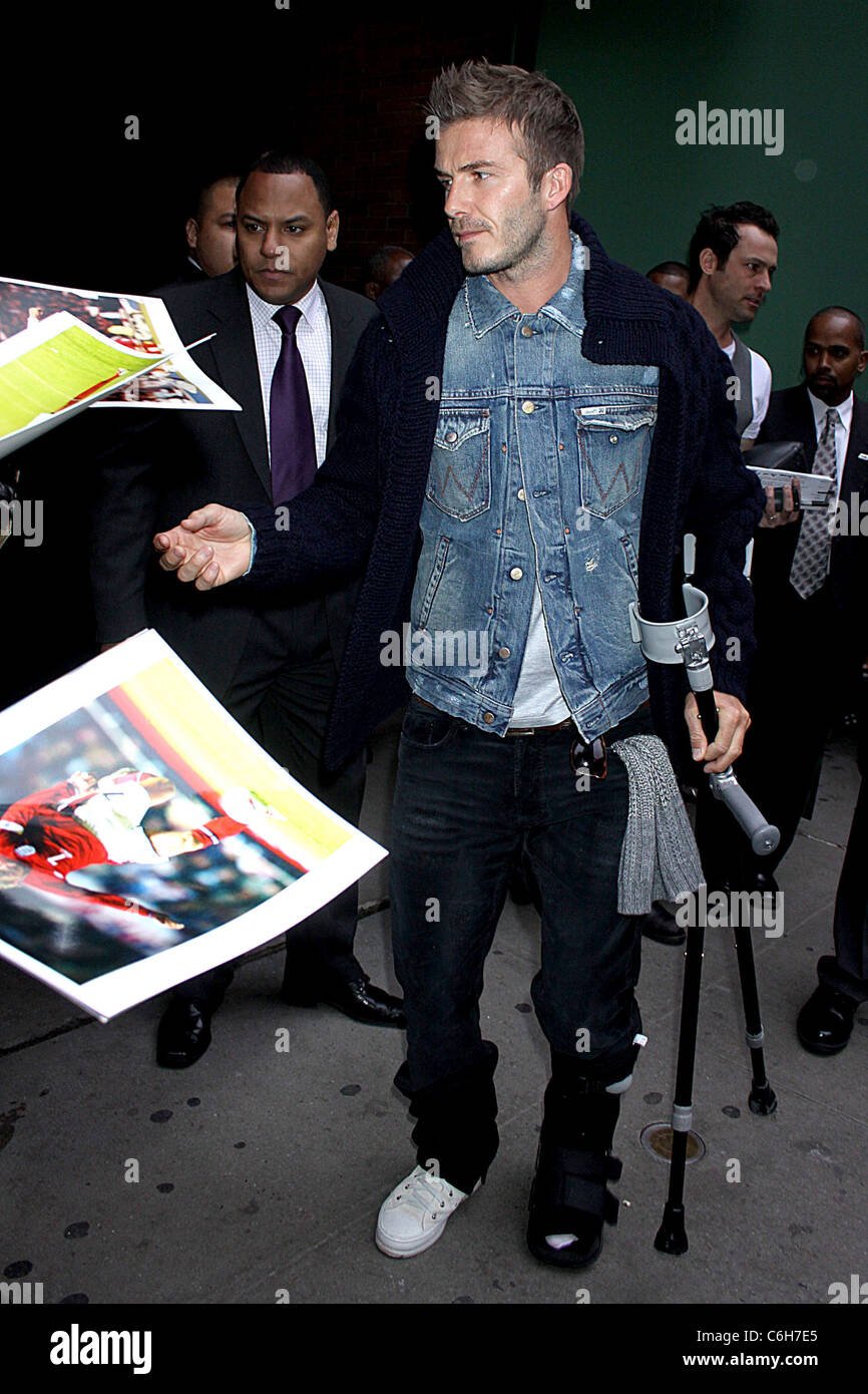 David Beckham signing autographs while leaving ABC's Times Square ...