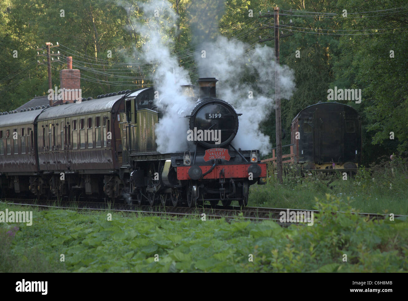 Steam locomotive leaving the station Stock Photo - Alamy