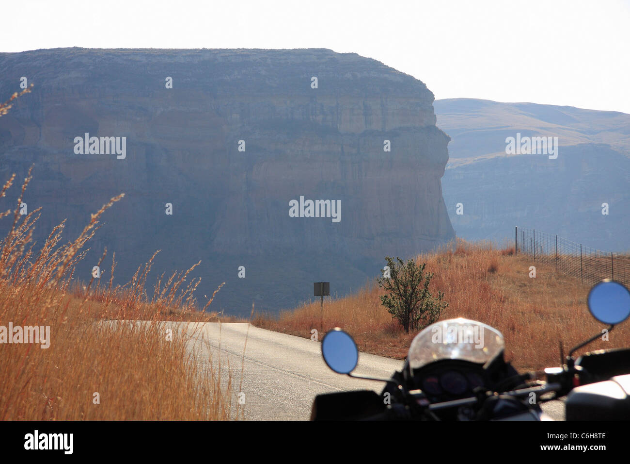 Scenic landscape with tar road and motorcycle Stock Photo - Alamy