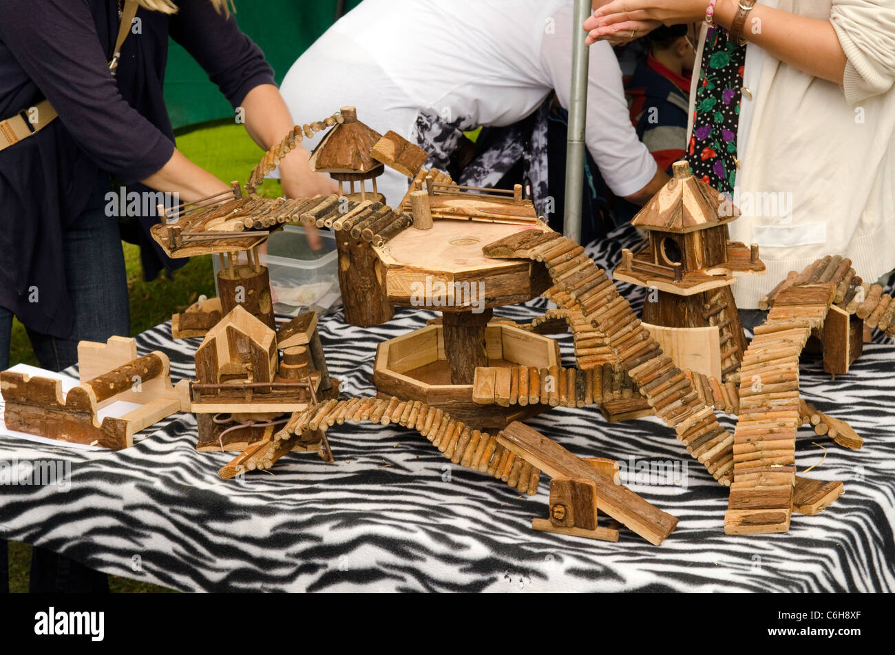 a wooden model toy structure used for tame pet mice to run around, an ...