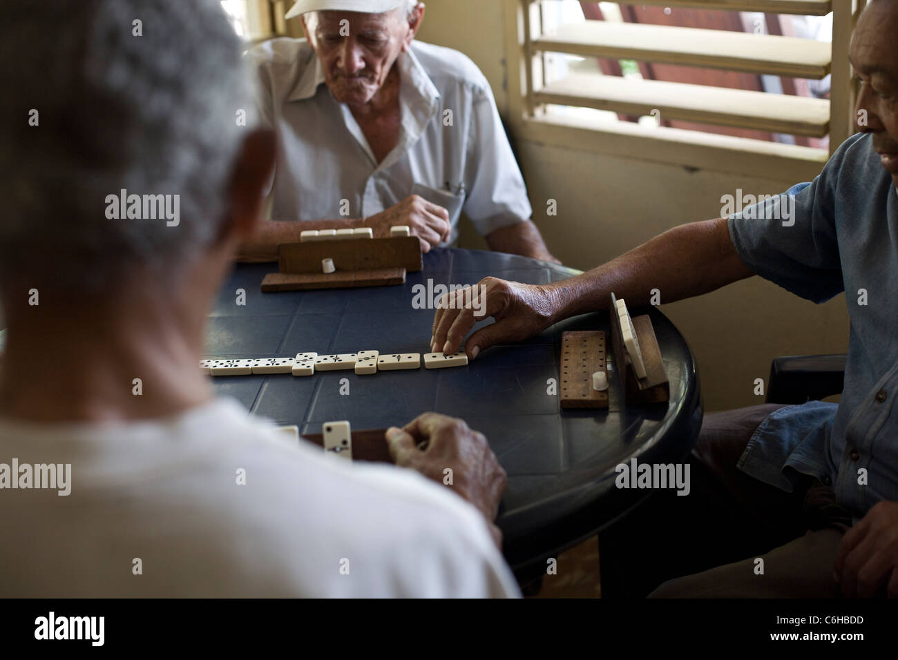 Guys playing domino, cuba Stock Photo - Alamy