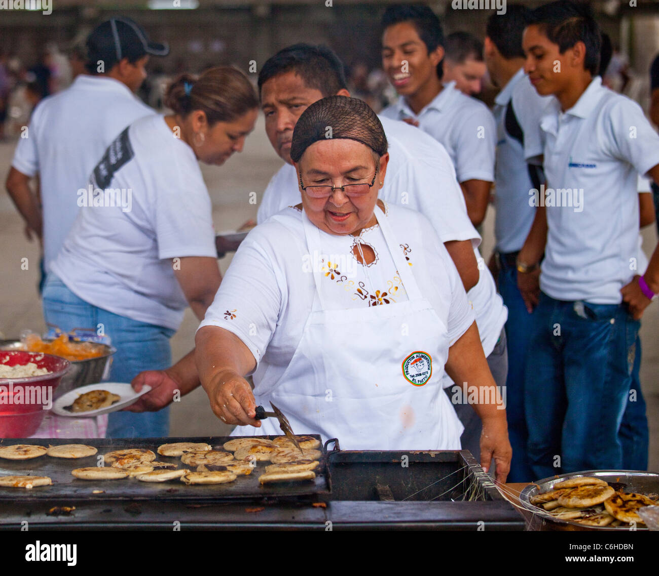 Woman cooking pupusas at a clinic from the USNS Comfort Hospital Ship ...