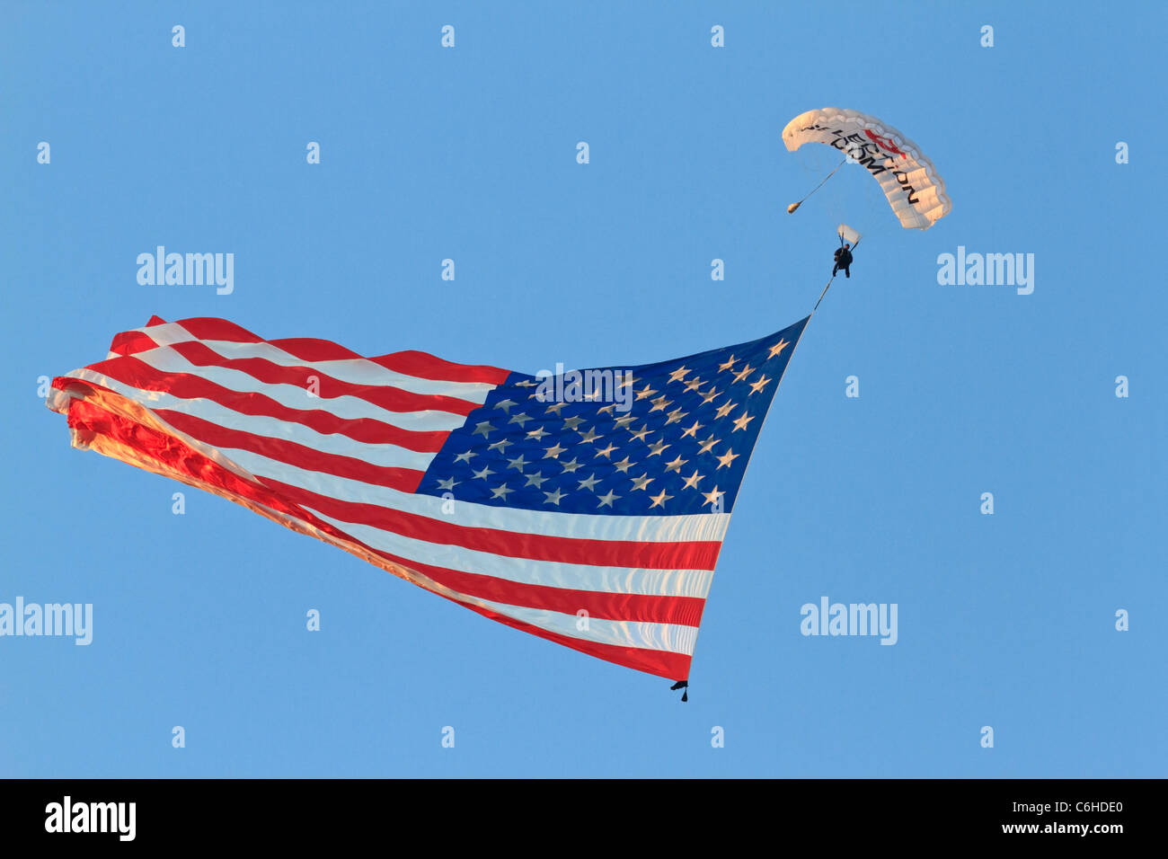 Skydiver carrying American flag Stock Photo - Alamy