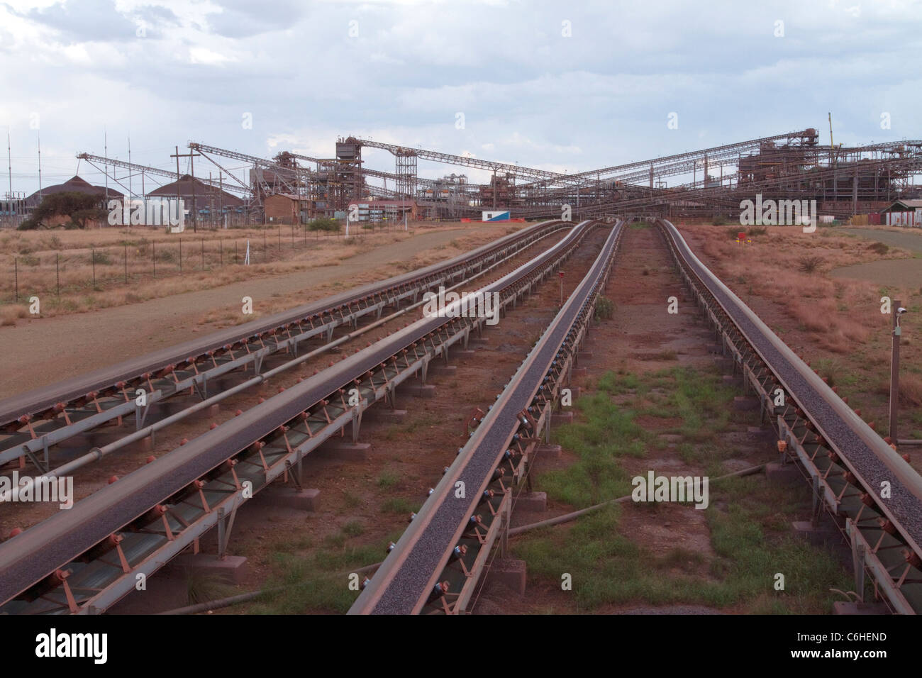 Conveyor belts carrying crushed ore towards a railway loading terminal ...