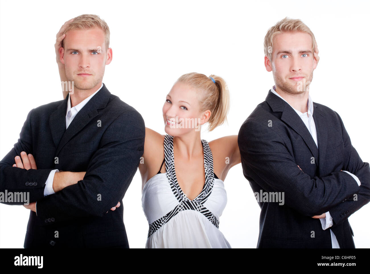 young woman in dress standing between two men in suits - isolated on ...