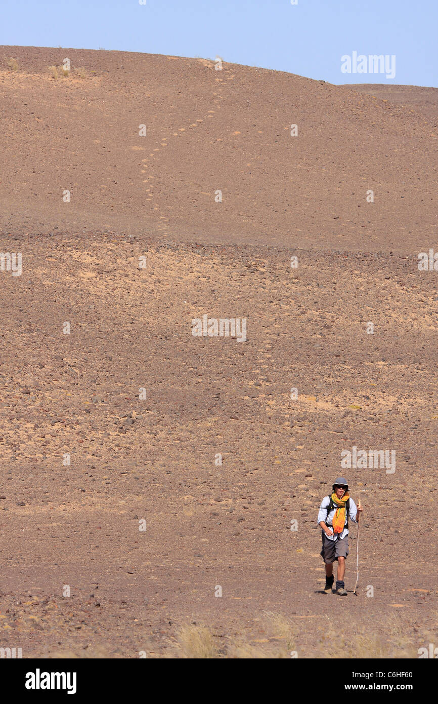 Hiker walking down a steep hill hi-res stock photography and images - Alamy