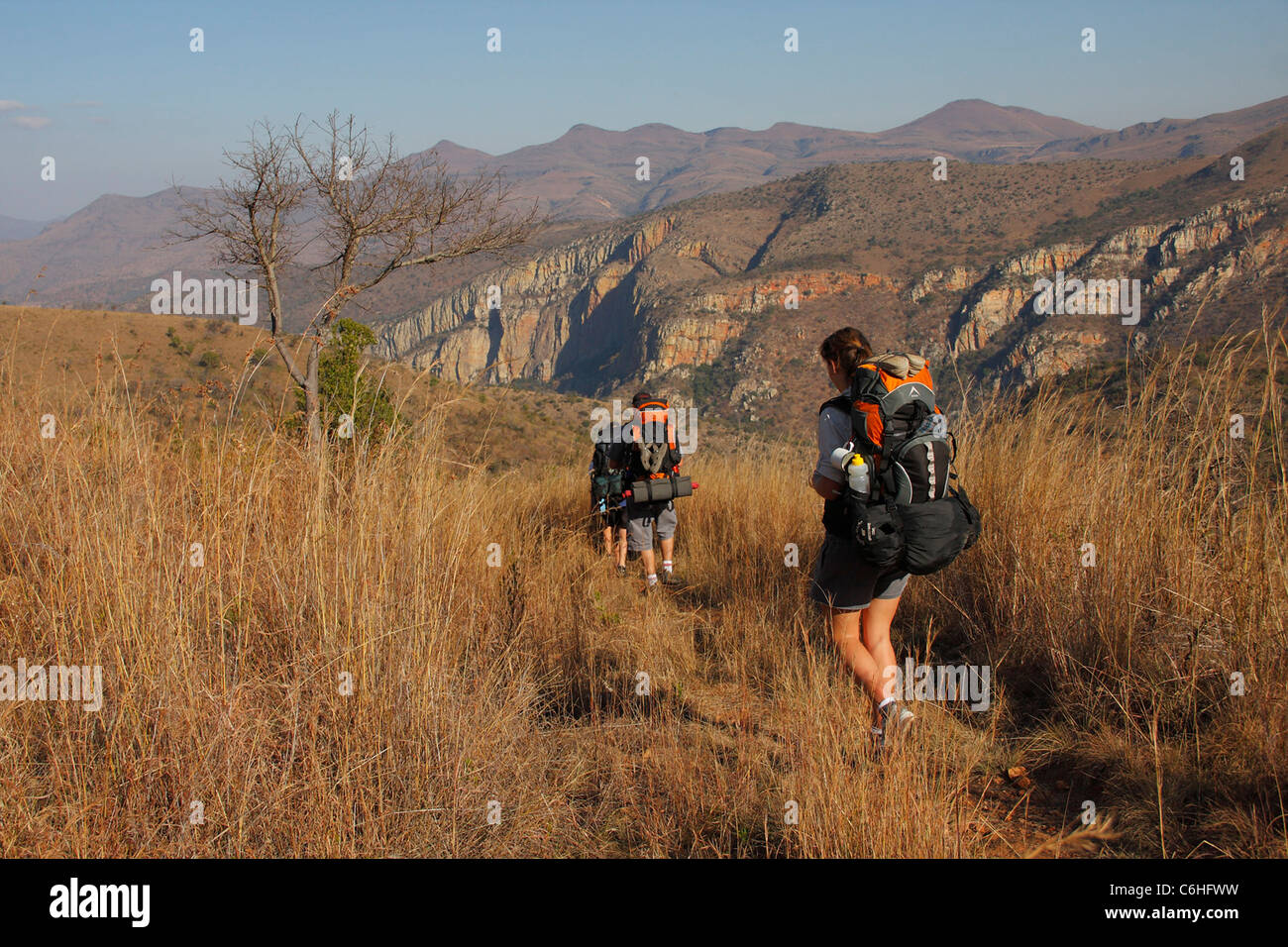 Hikers in mountain landscape Stock Photo - Alamy