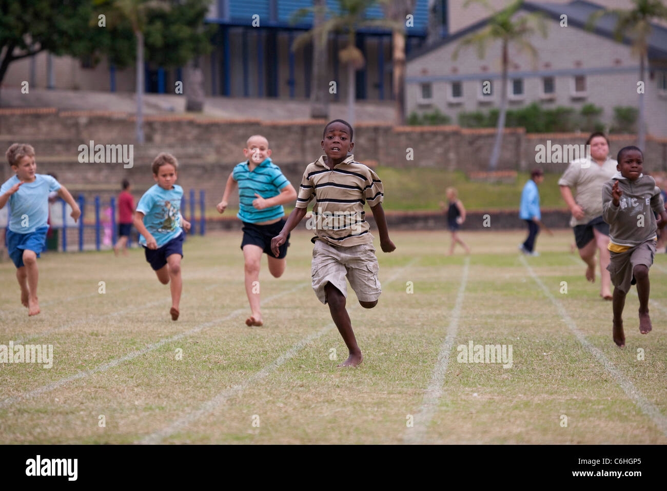 Primary school children running in inter-house athletics race Stock ...