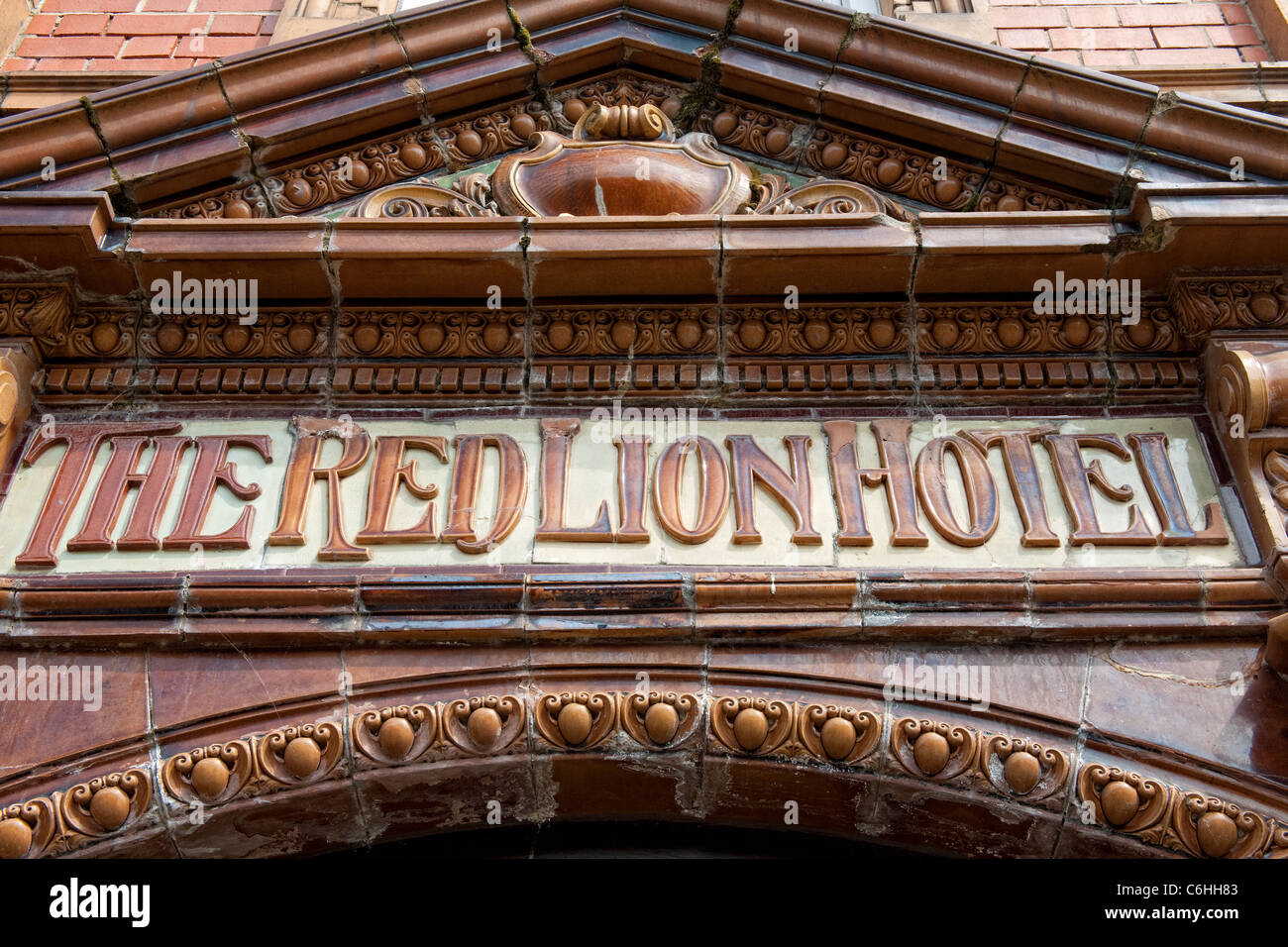 Ornate tiled frontage to the Red Lion Hotel public house Stock Photo ...