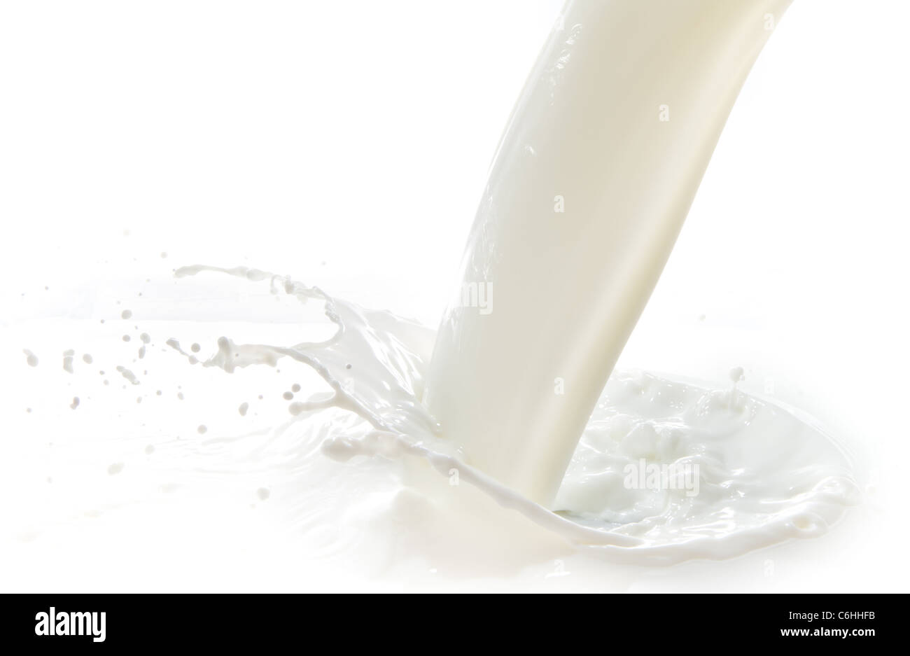pouring milk splash isolated on white background Stock Photo - Alamy