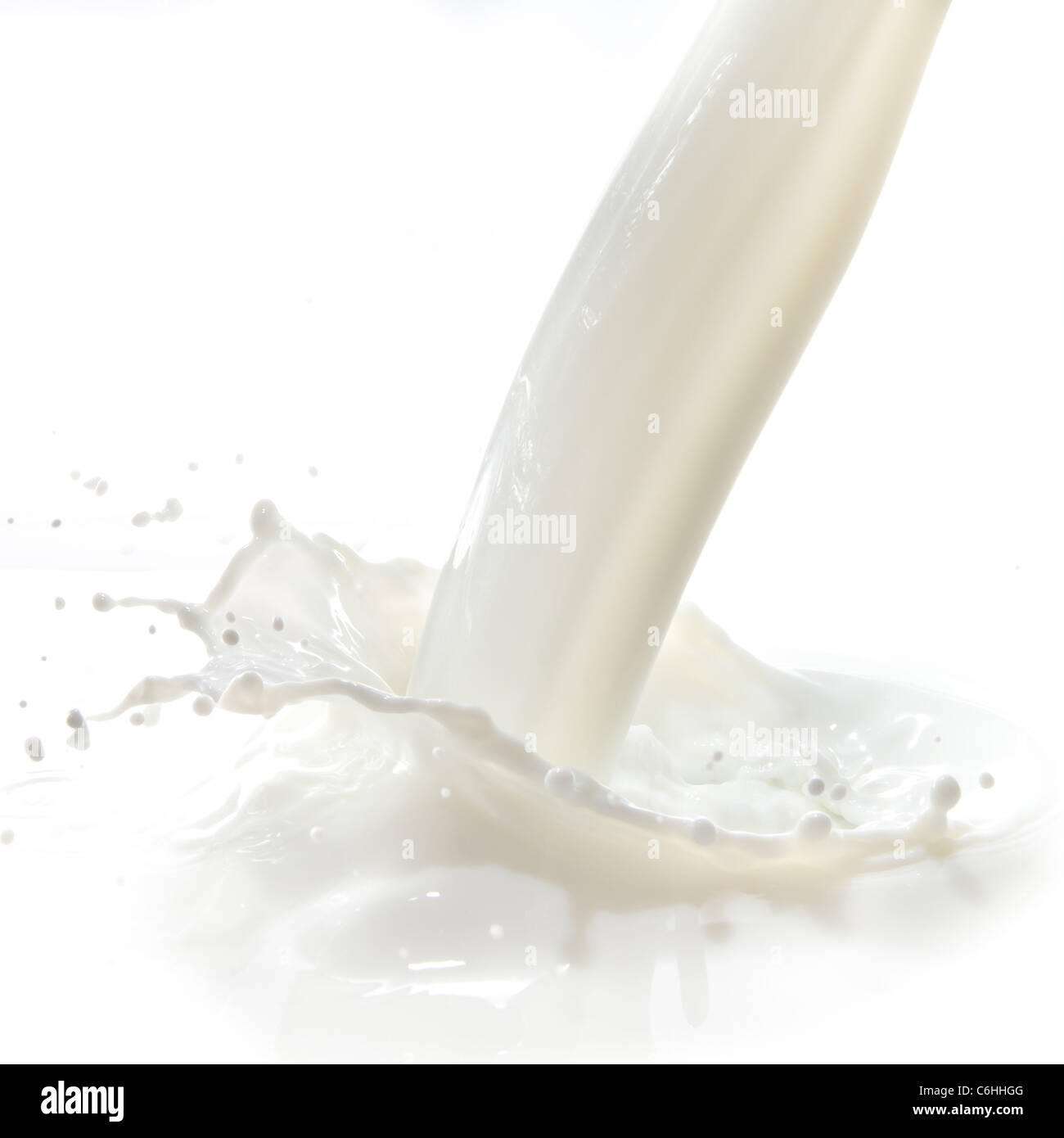 pouring milk splash isolated on white background Stock Photo - Alamy