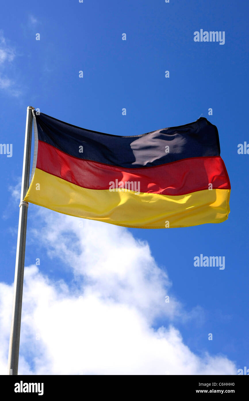 German Flag flying below the blue skies Stock Photo - Alamy