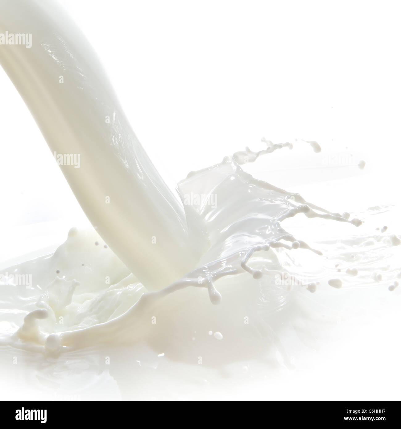 pouring milk splash isolated on white background Stock Photo - Alamy