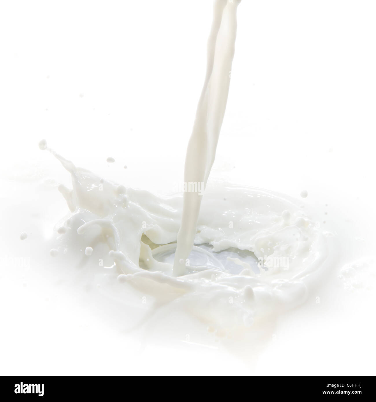 pouring milk splash isolated on white background Stock Photo - Alamy