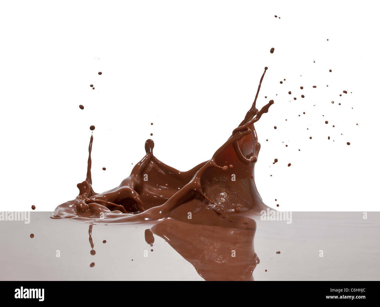 chocolate splash closeup isolated on white background Stock Photo - Alamy