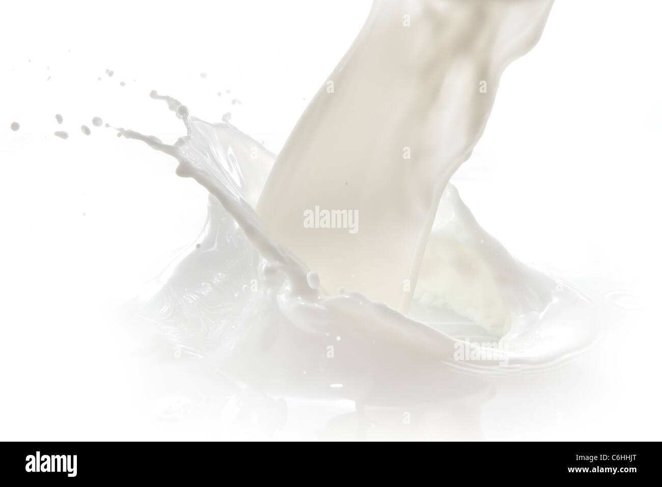 pouring milk splash isolated on white background Stock Photo - Alamy