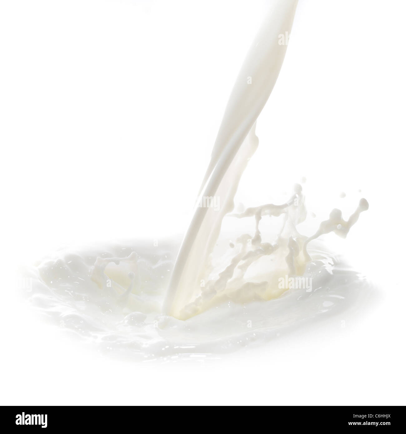 pouring milk splash isolated on white background Stock Photo - Alamy