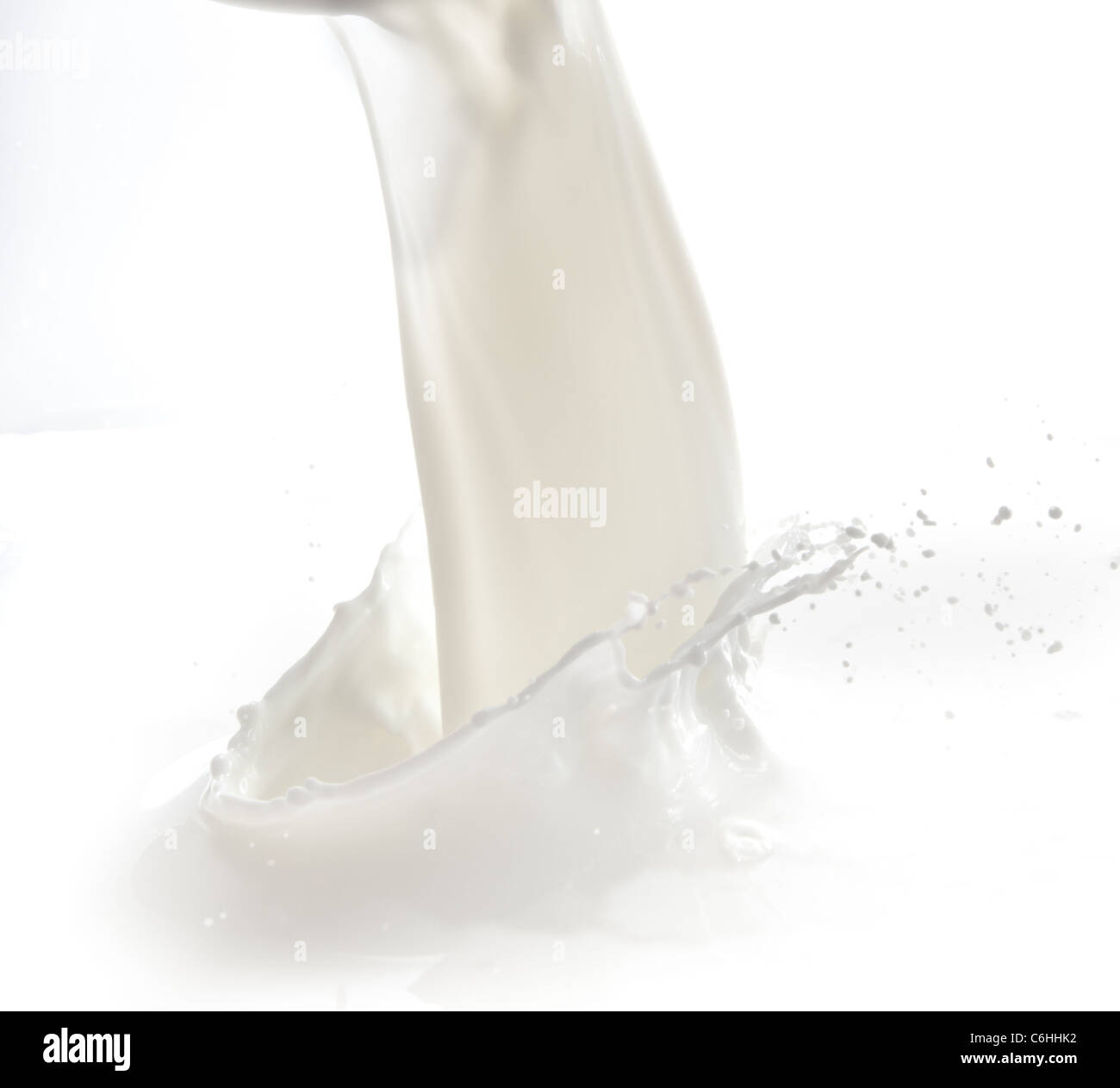 pouring milk splash isolated on white background Stock Photo - Alamy