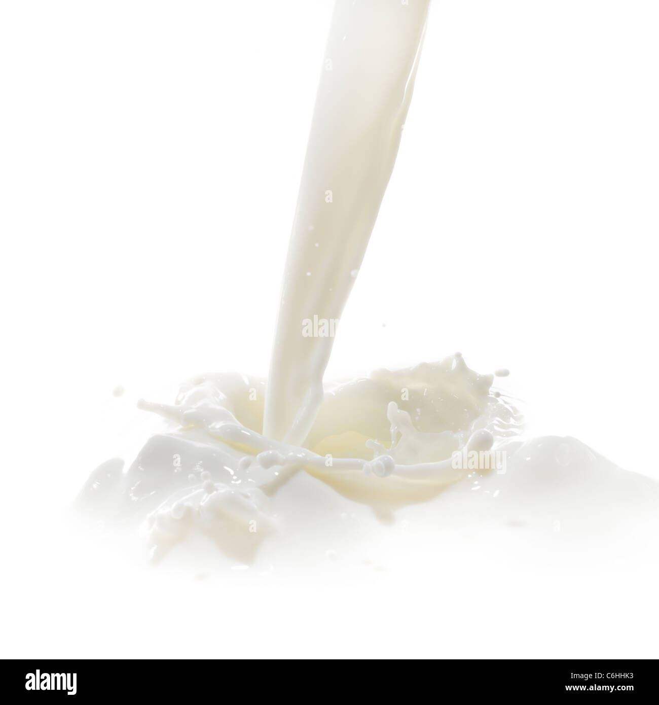 pouring milk splash isolated on white background Stock Photo - Alamy