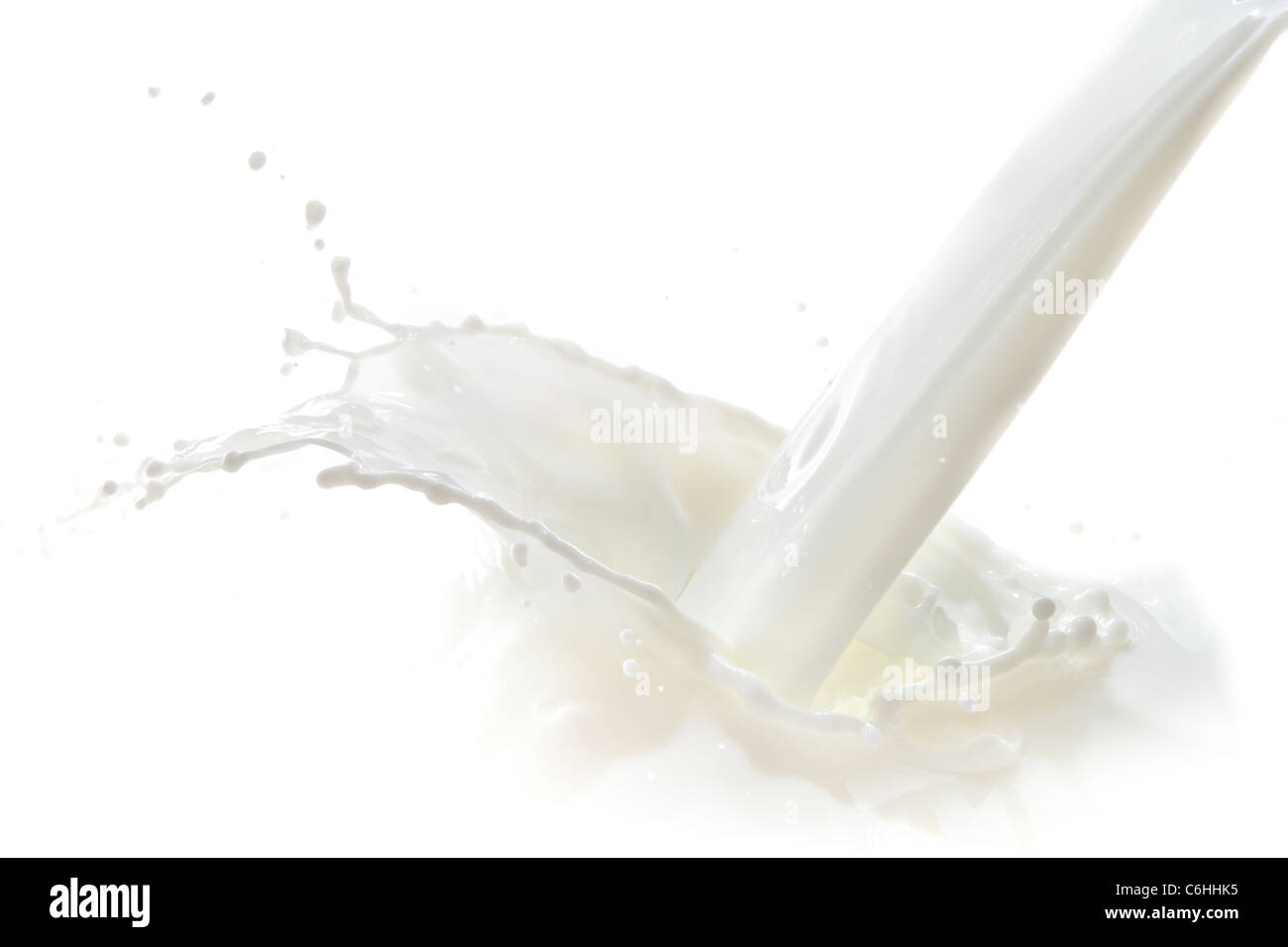 pouring milk splash isolated on white background Stock Photo - Alamy