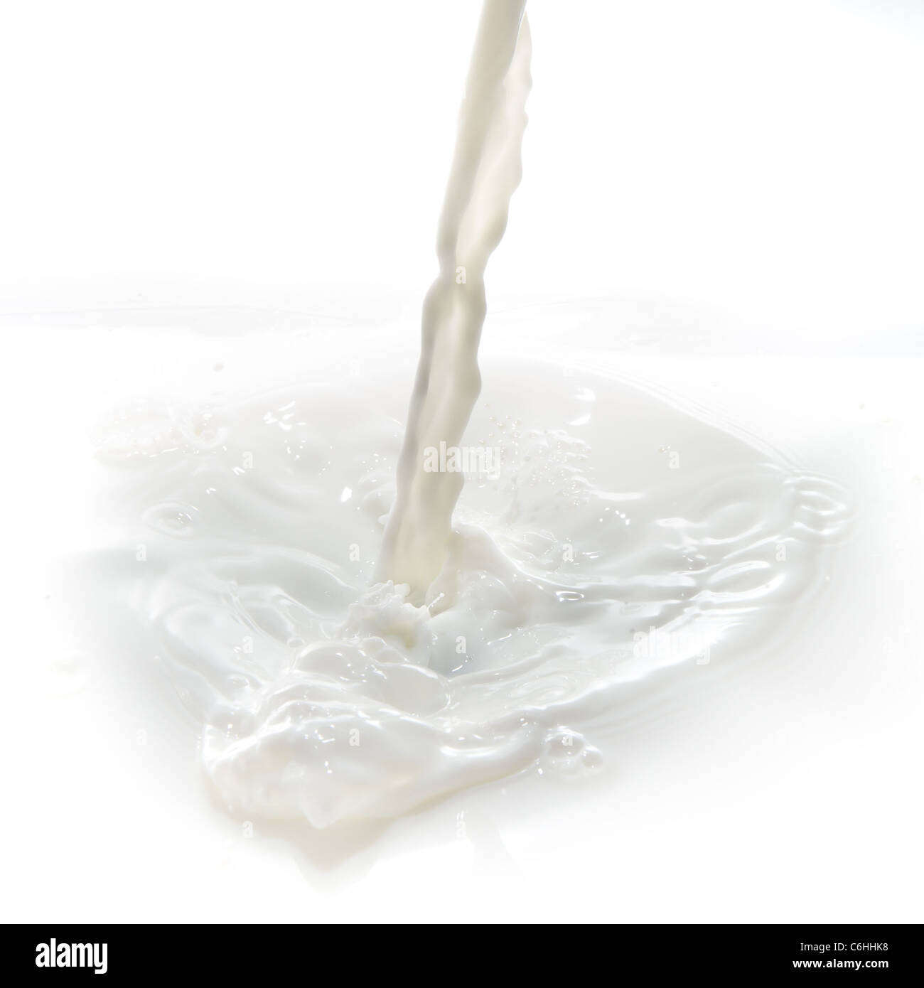 pouring milk splash isolated on white background Stock Photo - Alamy