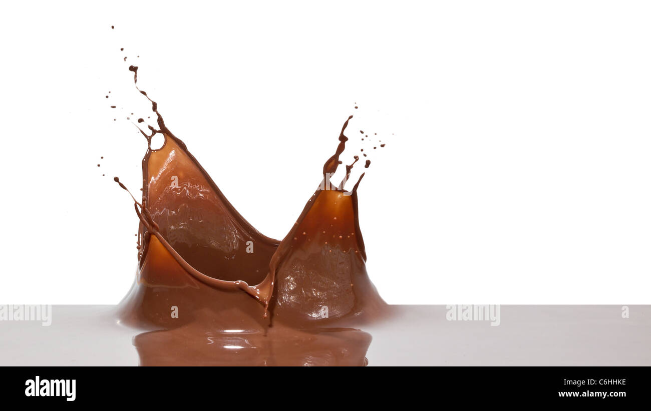 chocolate splash closeup isolated on white background Stock Photo - Alamy