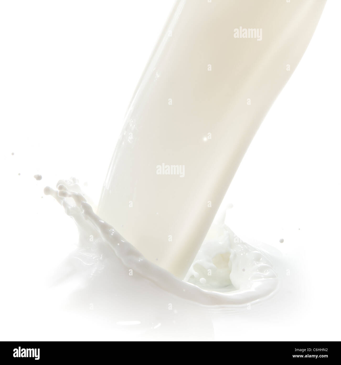 pouring milk splash isolated on white background Stock Photo - Alamy