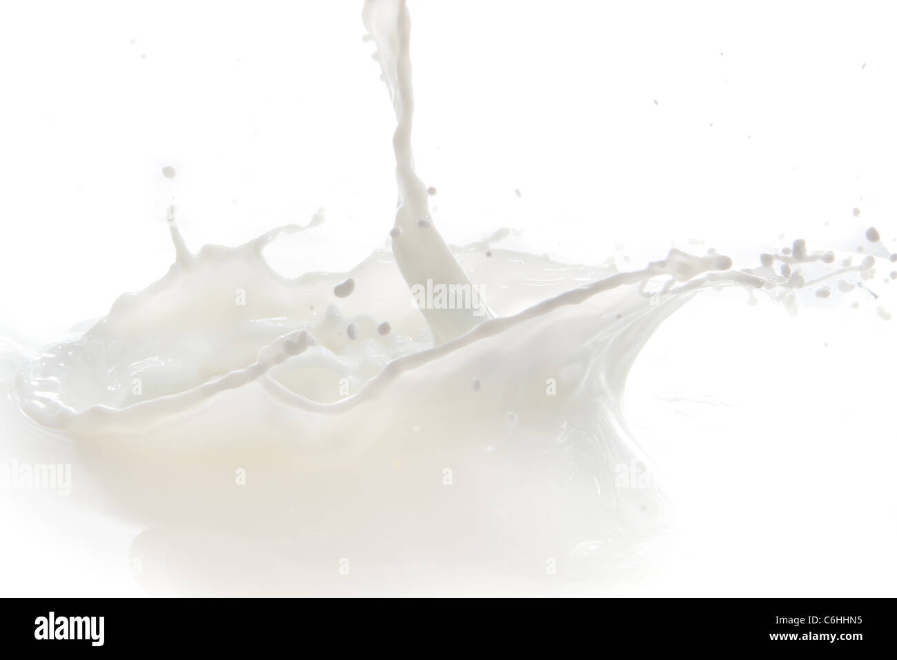 pouring milk splash isolated on white background Stock Photo - Alamy