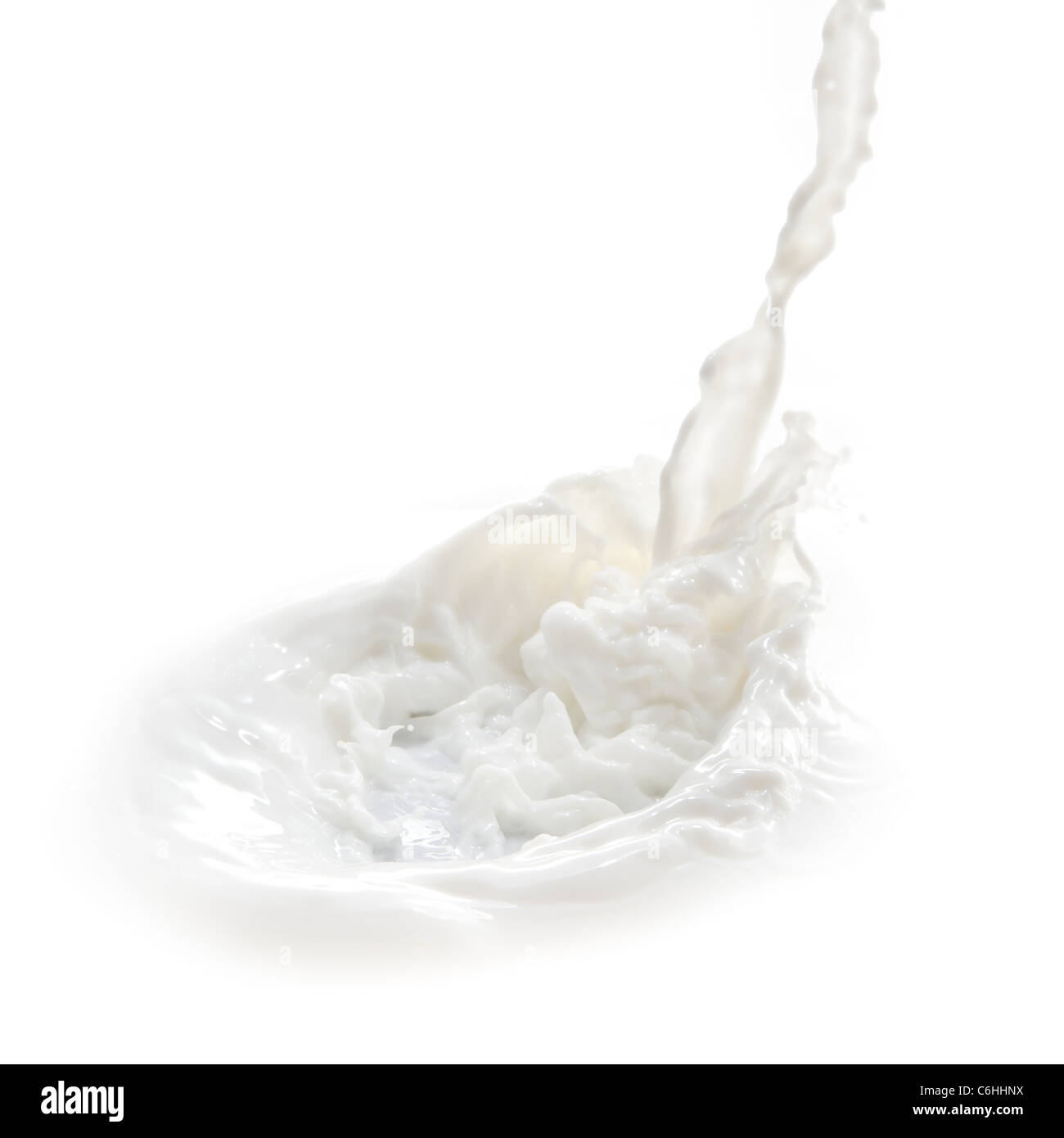 pouring milk splash isolated on white background Stock Photo - Alamy