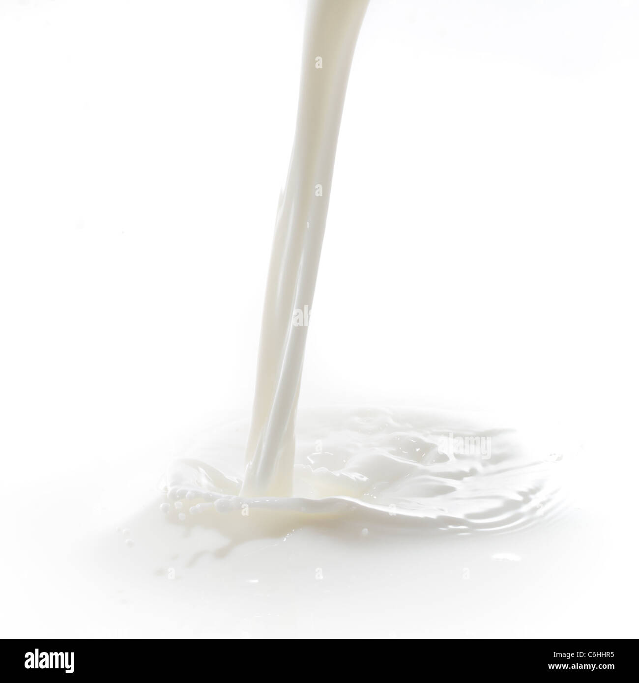 pouring milk splash isolated on white background Stock Photo - Alamy