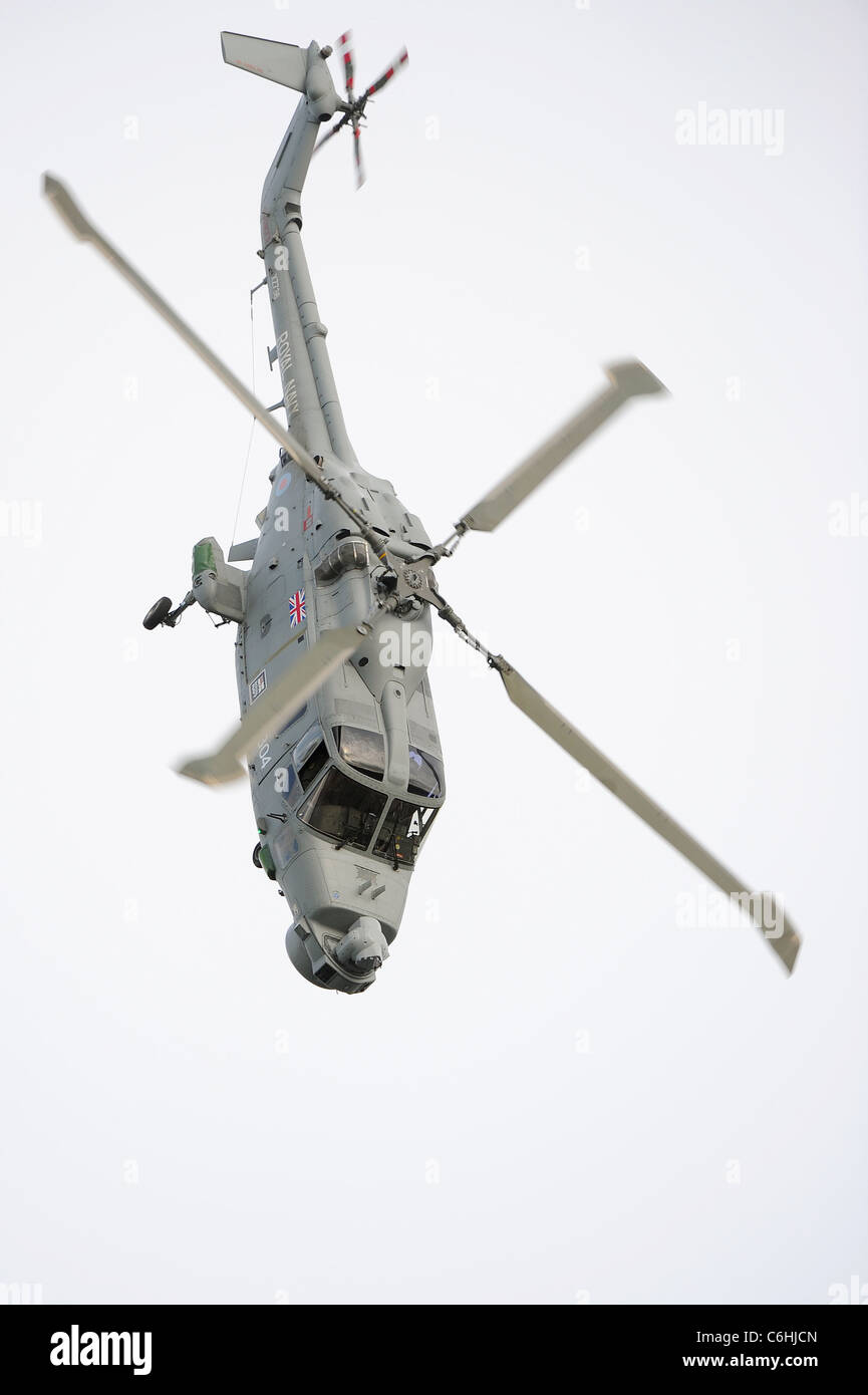 A Royal Navy Lynx helicopter maneuvering in the sky above the River ...