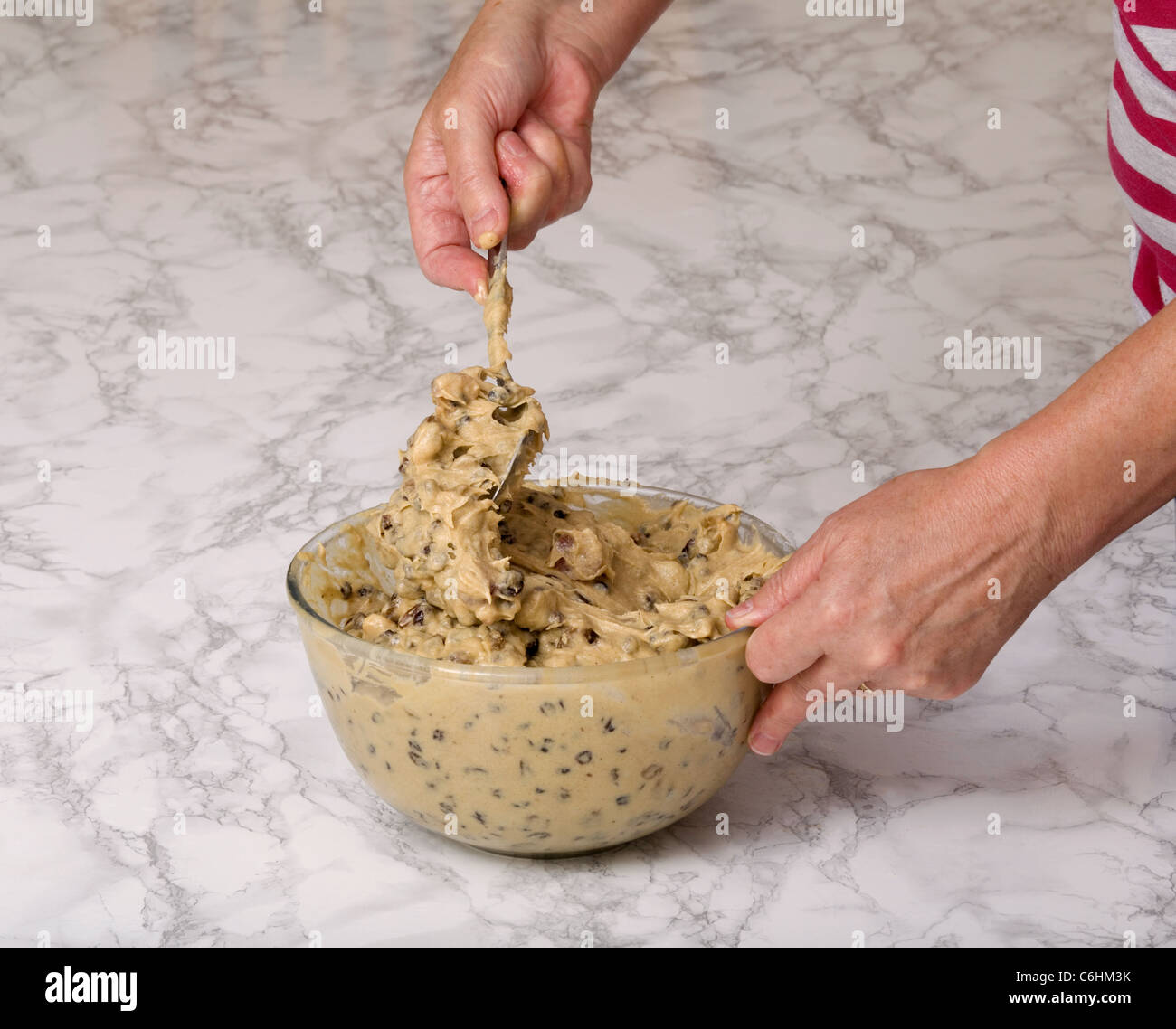 A cake mix being checked/stirred prior to cooking; with room for text ...