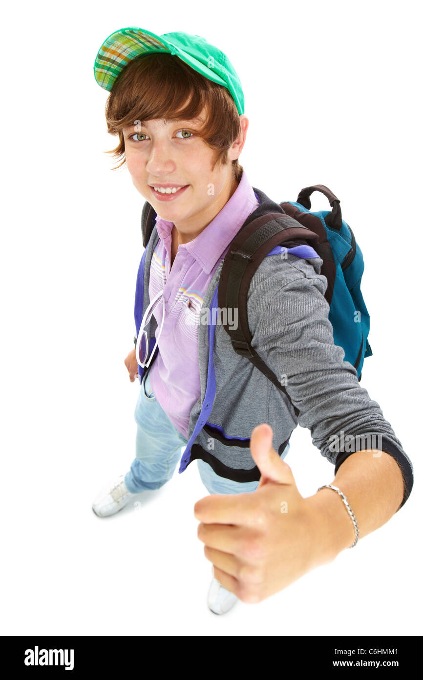 Portrait of teenage boy with backpack looking at camera and showing ...