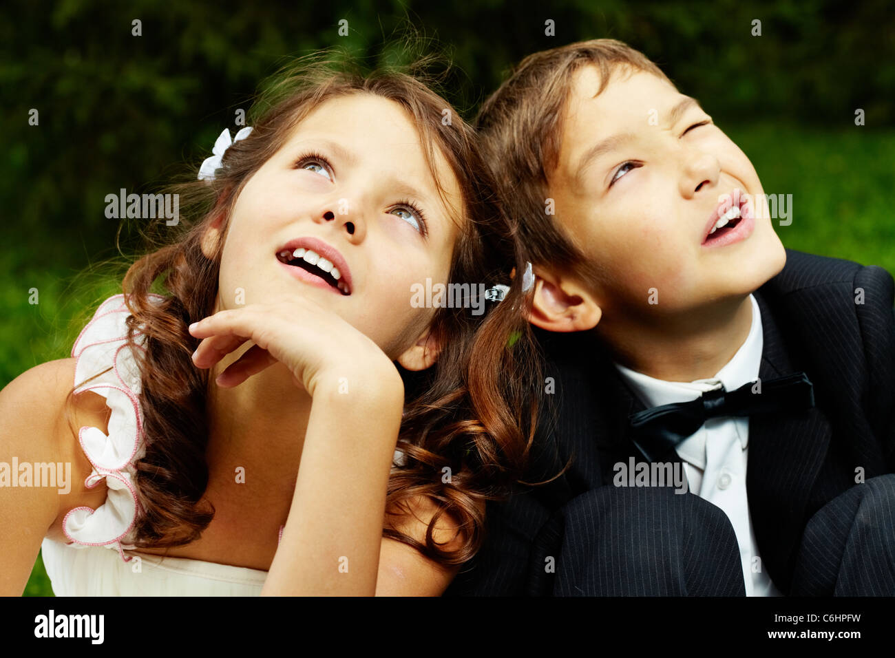 Portrait of cute boy groom and girl bride Stock Photo - Alamy