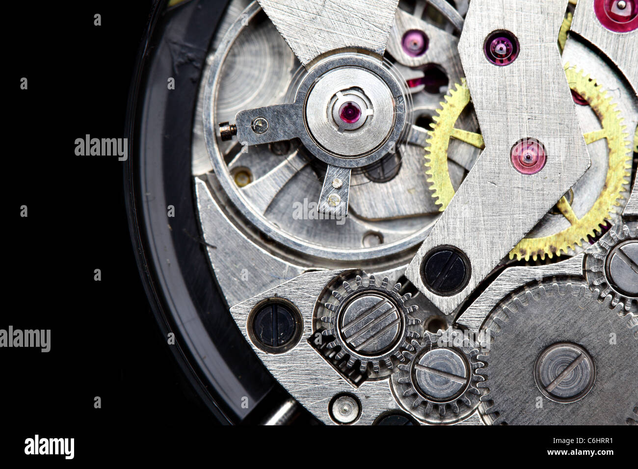 Clockwork macro isolated over the black background Stock Photo - Alamy