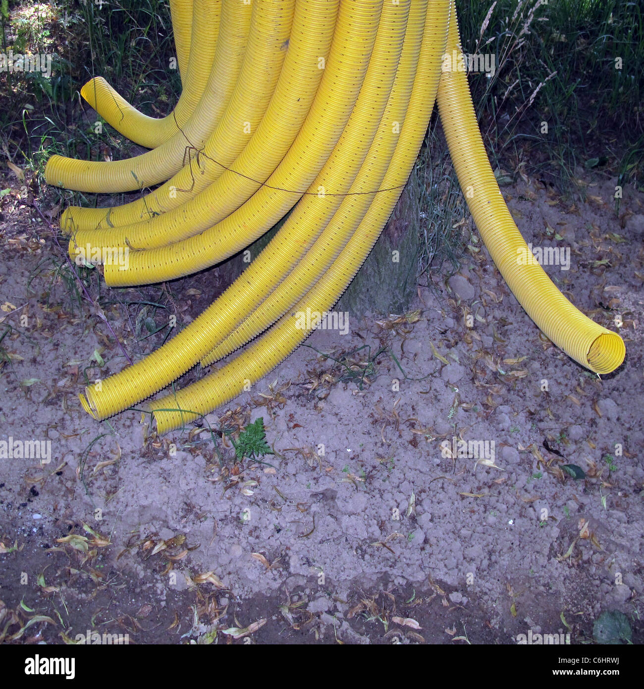 yellow plastic pipes abstract Stock Photo - Alamy