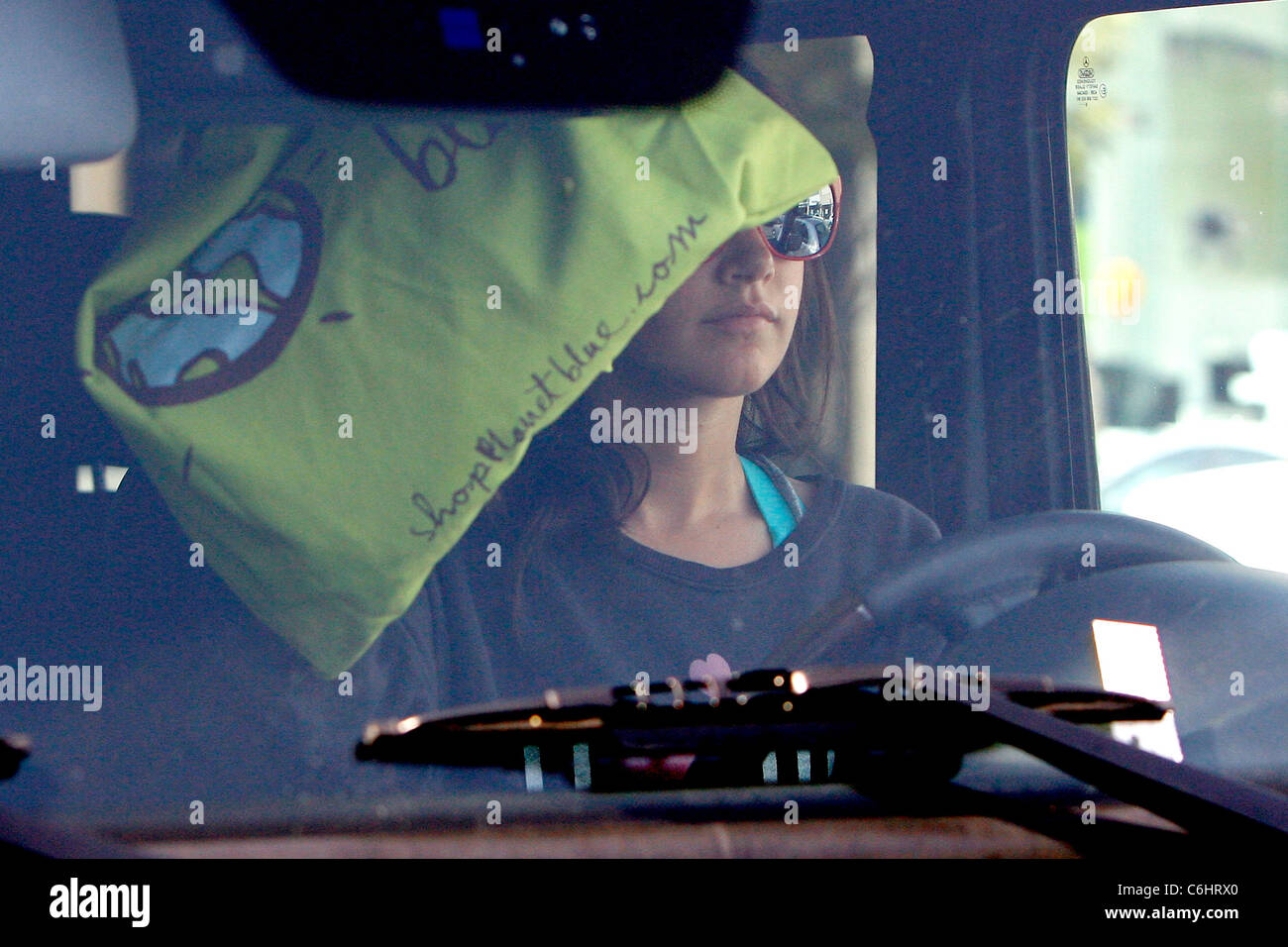 Ashley Tisdale covers her face with her shopping bag as she leaves ...